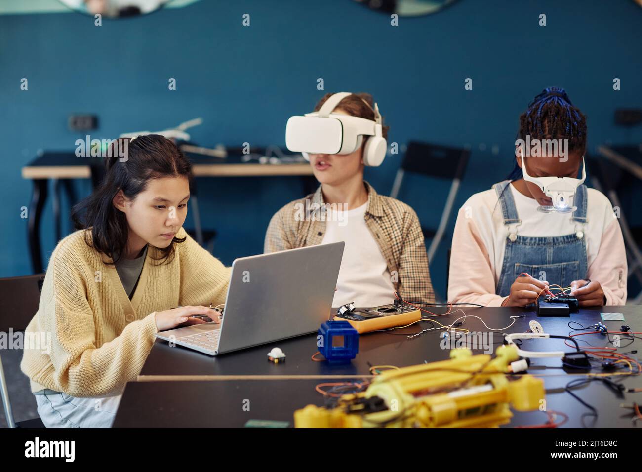 Stem education. Children building robots in classroom Stock Photo - Alamy