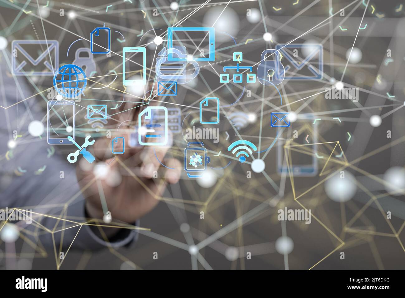 A blurred shot of a man touching 3d rendered icons shows network ...