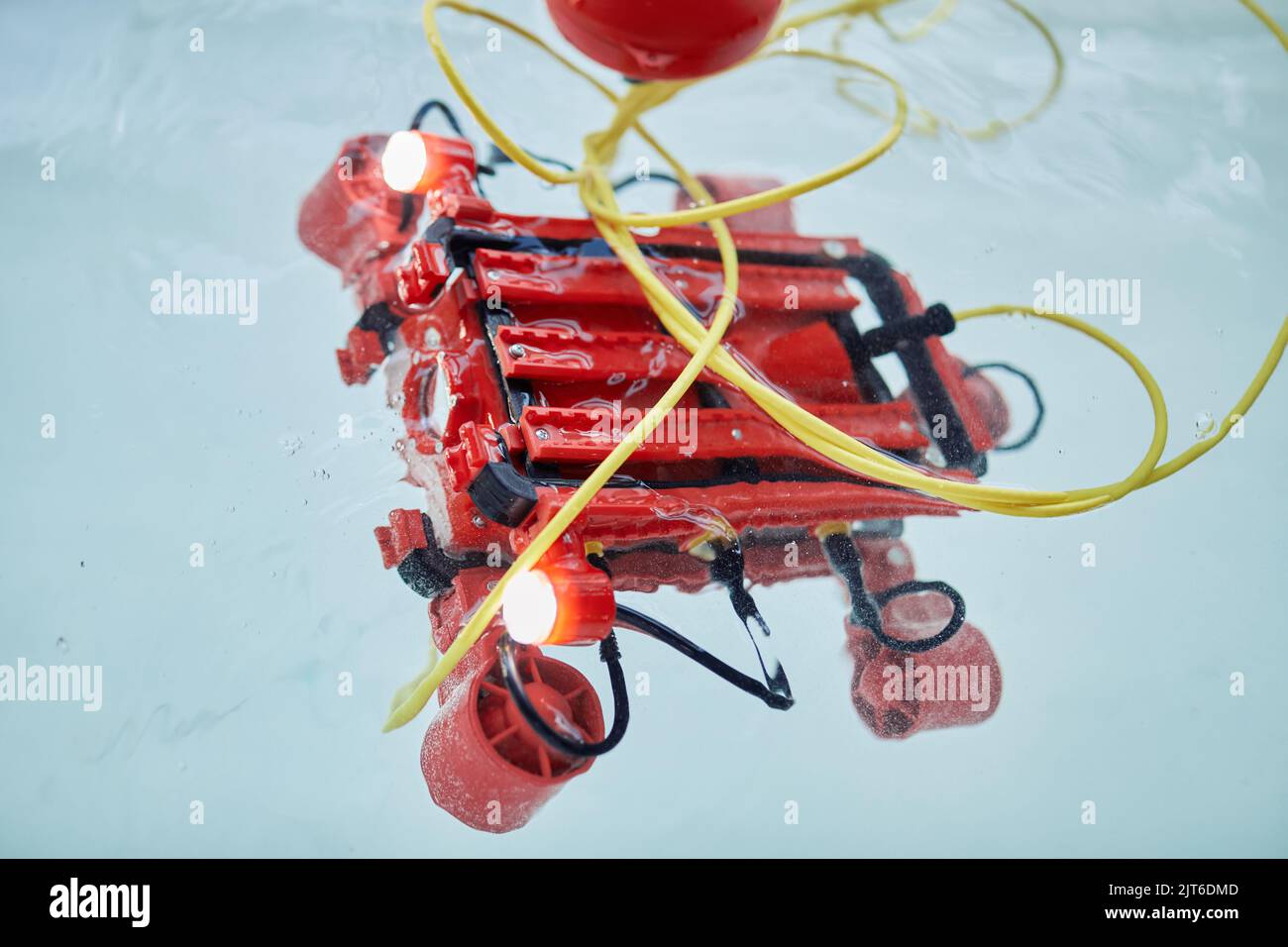 Background image or red robot submarine in water tank in engineering ...