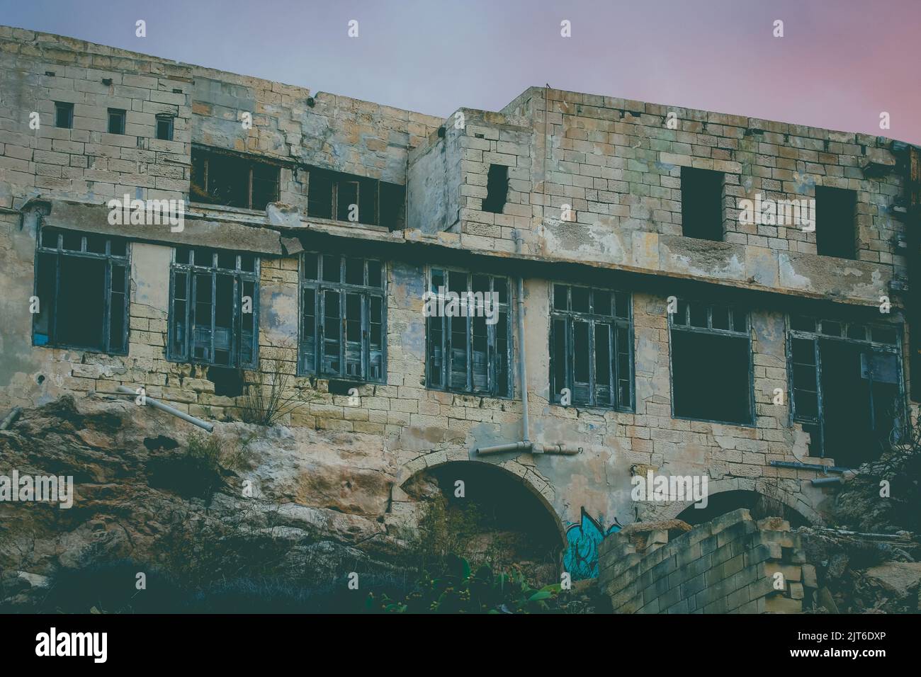 An old ruined building with broken windows and walls,concept of ...