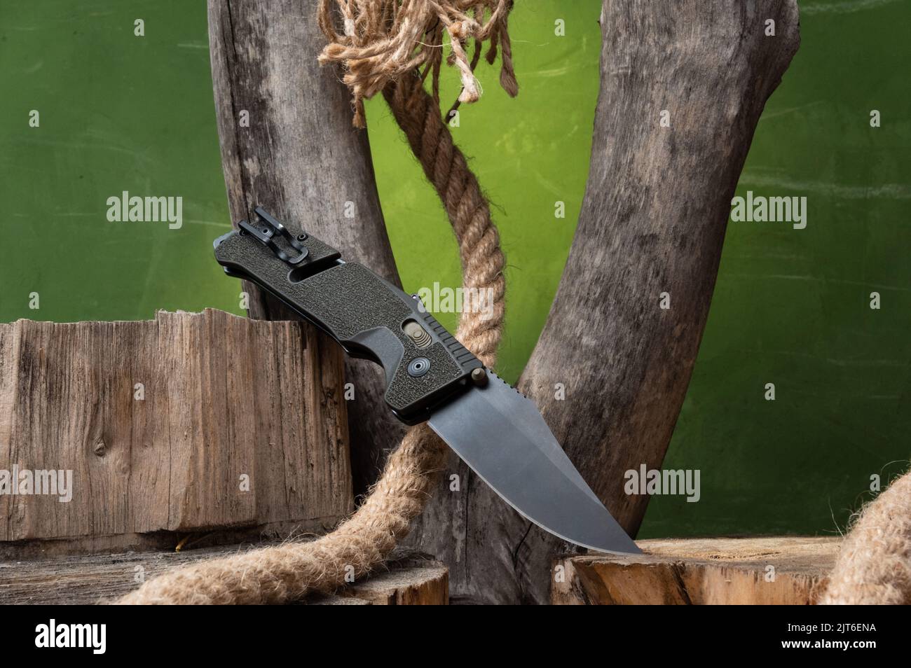 Folding army knife with a black blade. Knife on the background of a ...