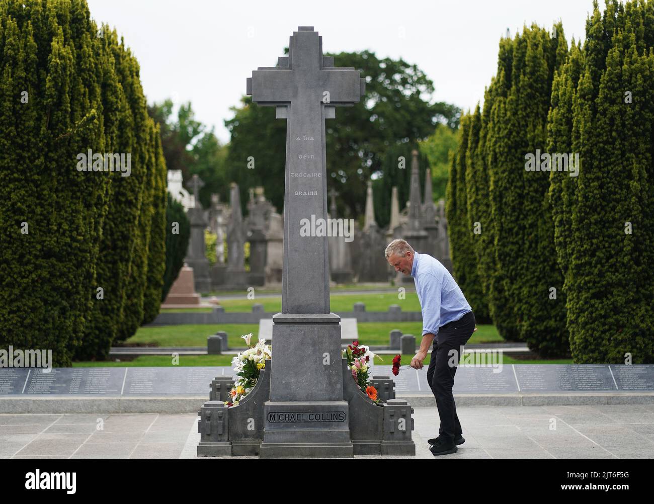 Fintan Lalor, from Co. Laois, places flowers at the grave of Michael ...