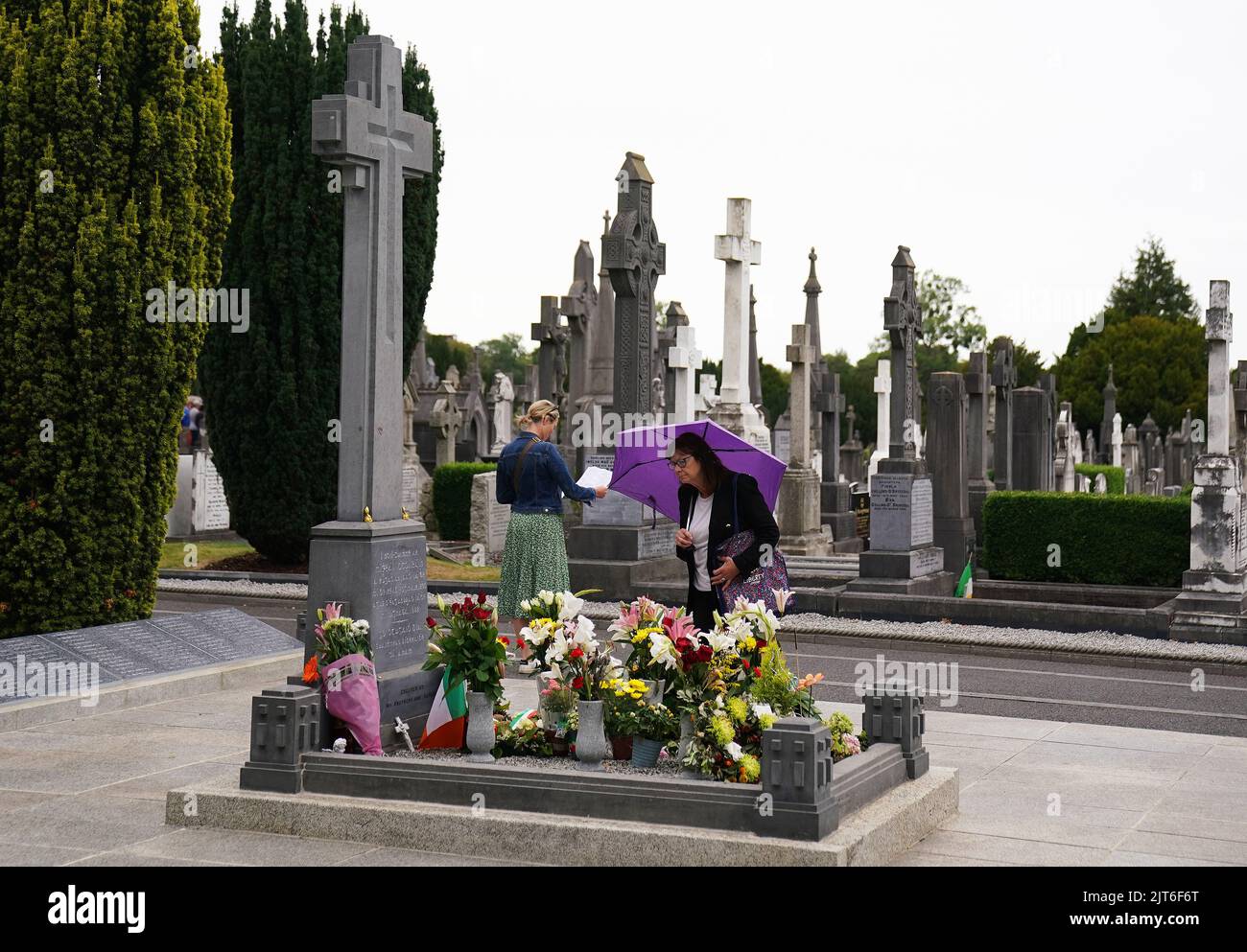 People visit the grave of Michael Collins in Glasnevin cemetery, Dublin ...