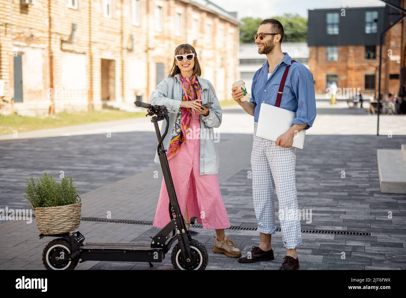 Stylish colleagues meet together outdoors Stock Photo - Alamy