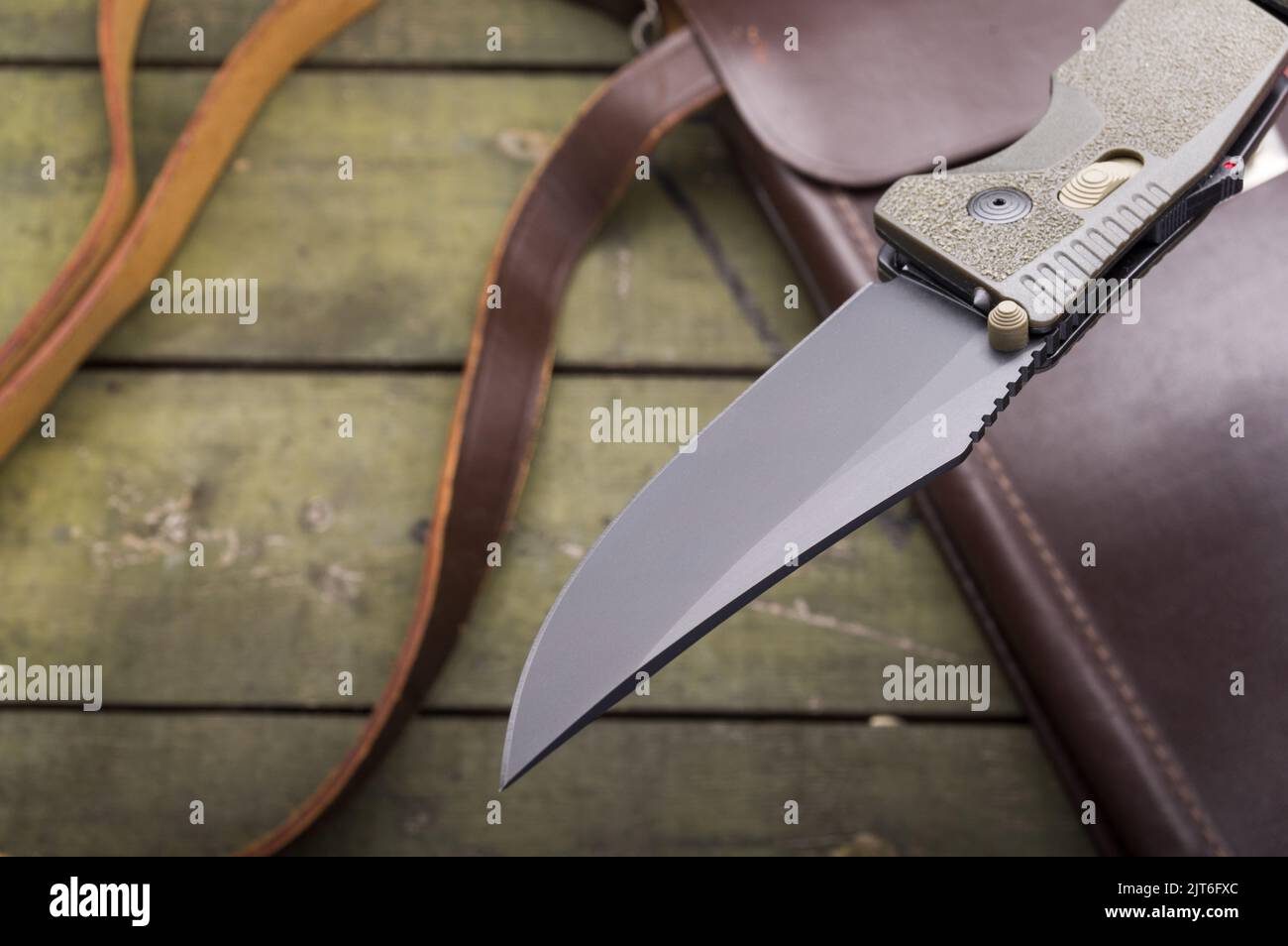 The blade of the knife is pierced in the air. Knife over the table ...