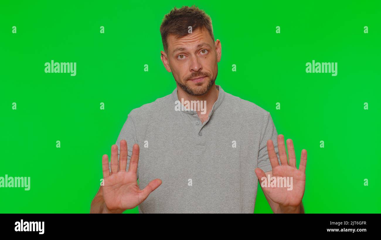 Hey you, be careful. Young man warning with admonishing finger gesture ...