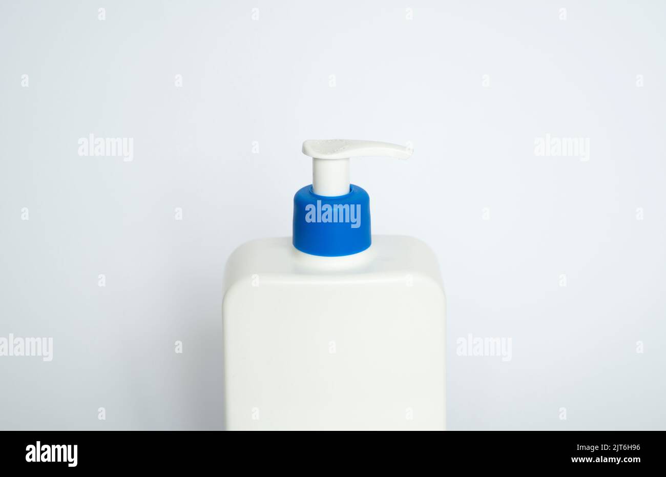 White unbranded plastic dispenser pump bottle on white background ...