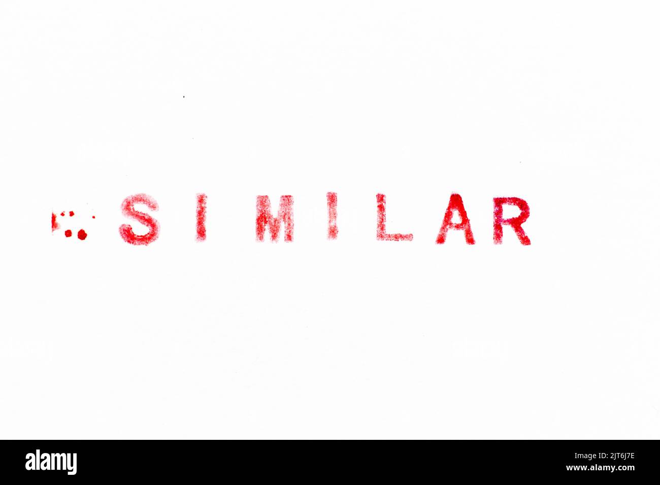 Red color ink rubber stamp in word similar on white paper background ...