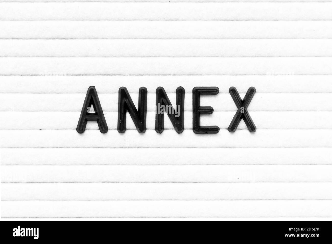Black color letter in word annex on white felt board background Stock ...