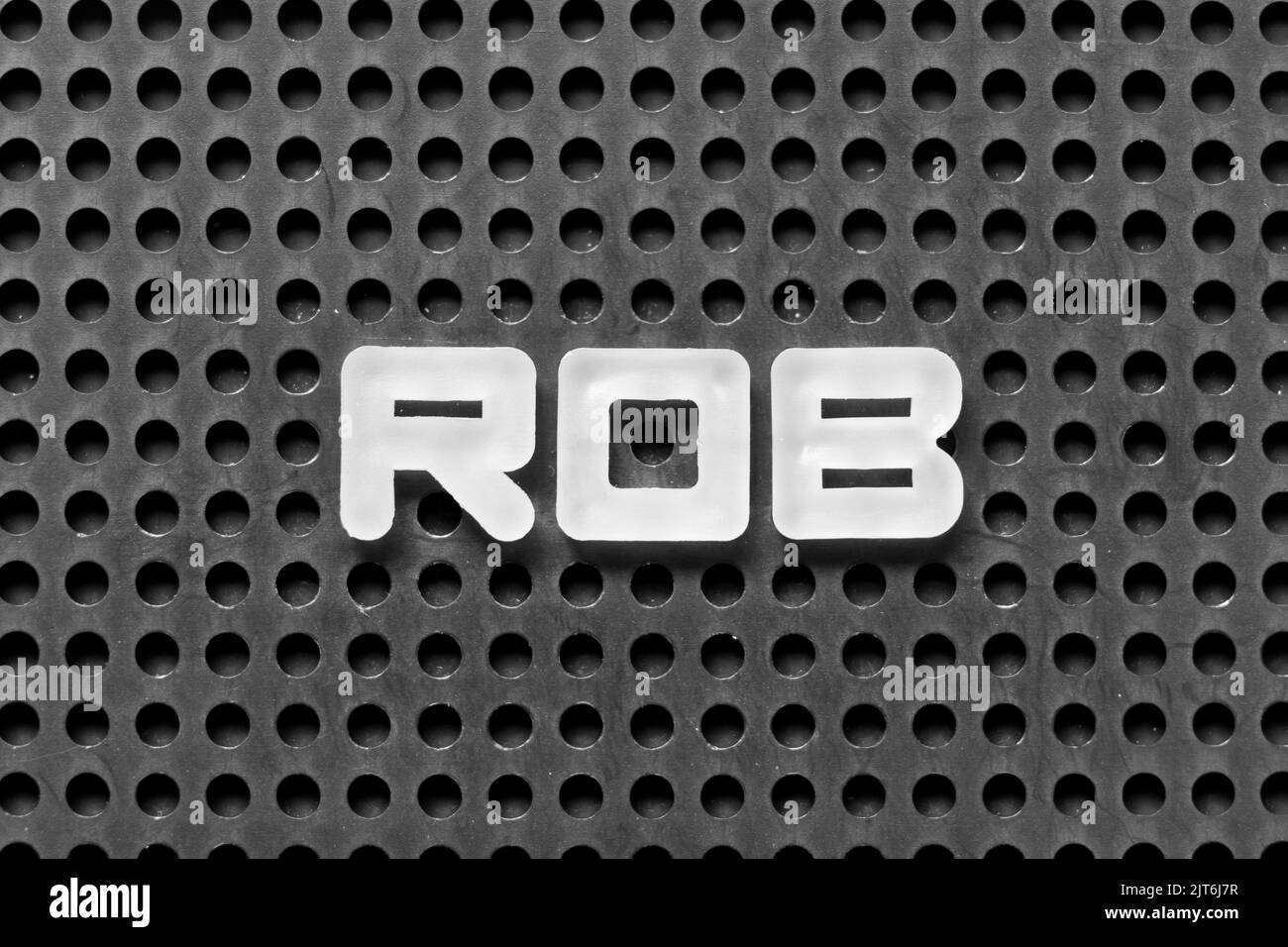 White alphabet letter in word ROB (Abbreviation of Rhythm of business ...