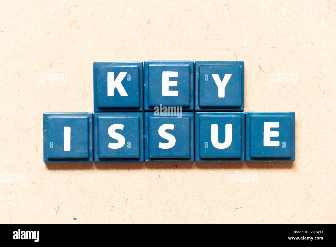 Tile letter in english word key issue on wood background Stock Photo ...