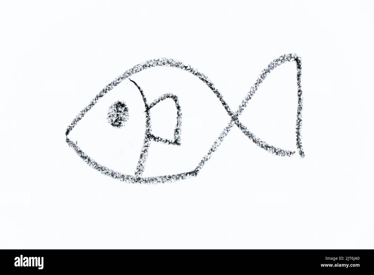 Black color crayon hand drawing in fish shape on white paper background ...