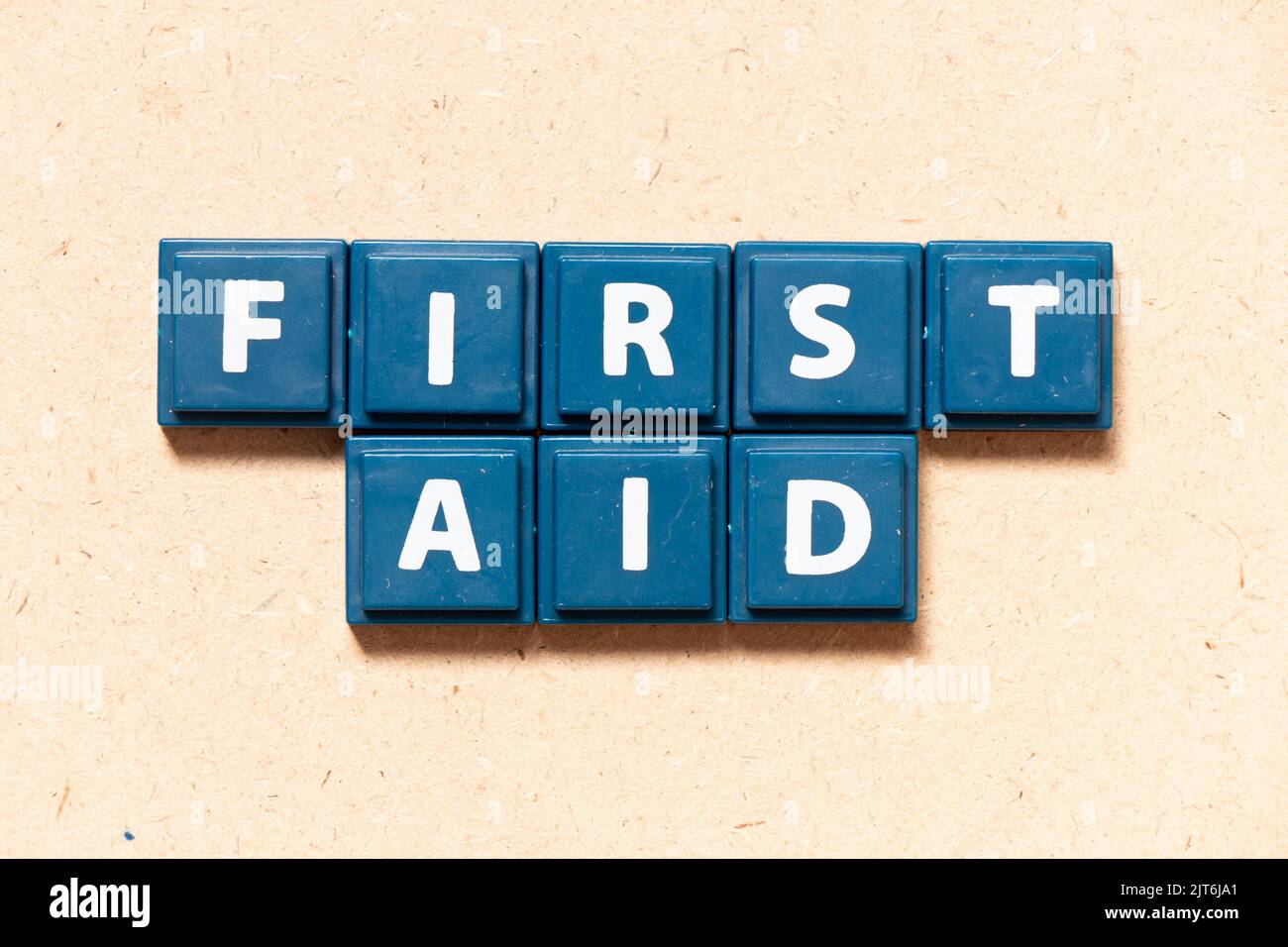 Tile letter in english word first aid on wood background Stock Photo ...