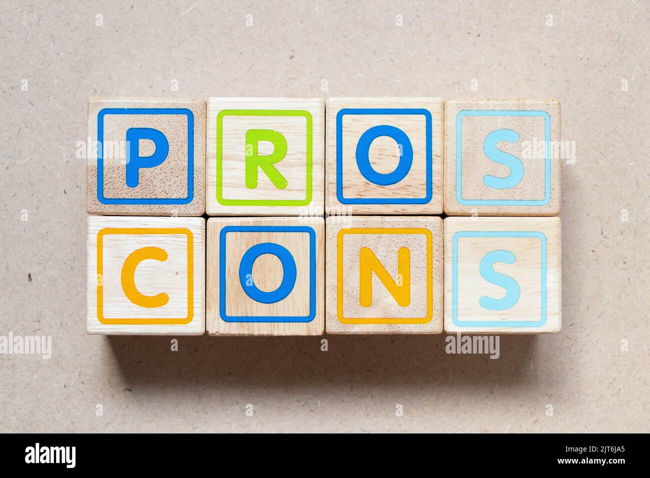 Color letter block in word pros cons on wood background Stock Photo - Alamy