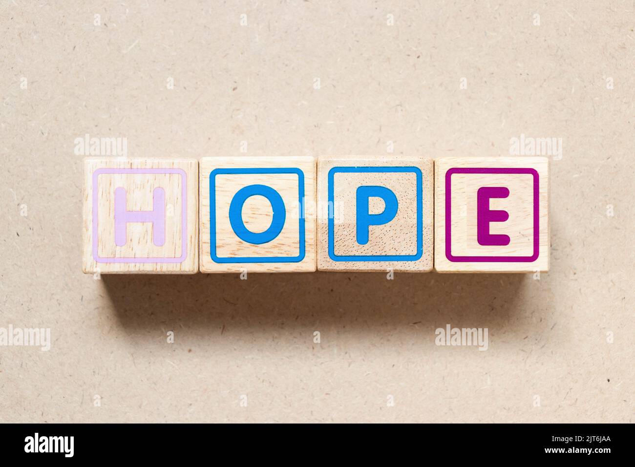 Color letter block in word hope on wood background Stock Photo - Alamy