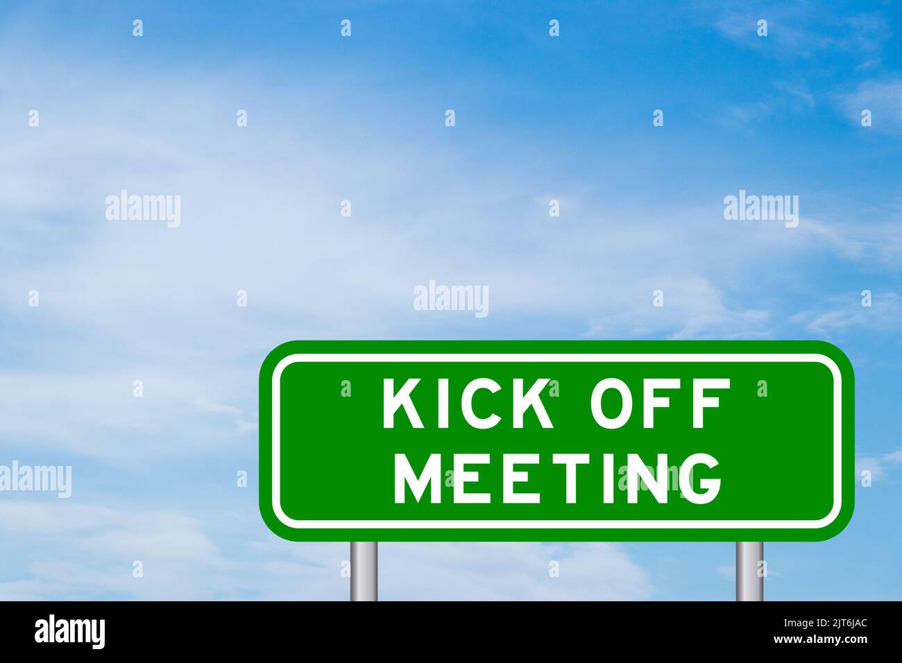 Green color transportation sign with word kick off meeting on blue sky ...