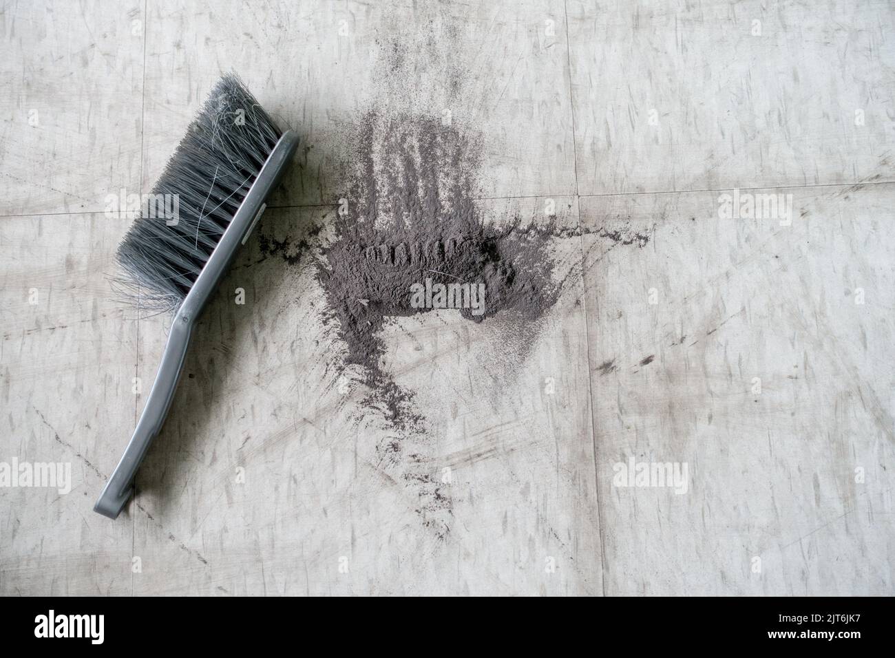 Broom used to sweep up volcanic ash from eruption of Turrialba Volcano ...