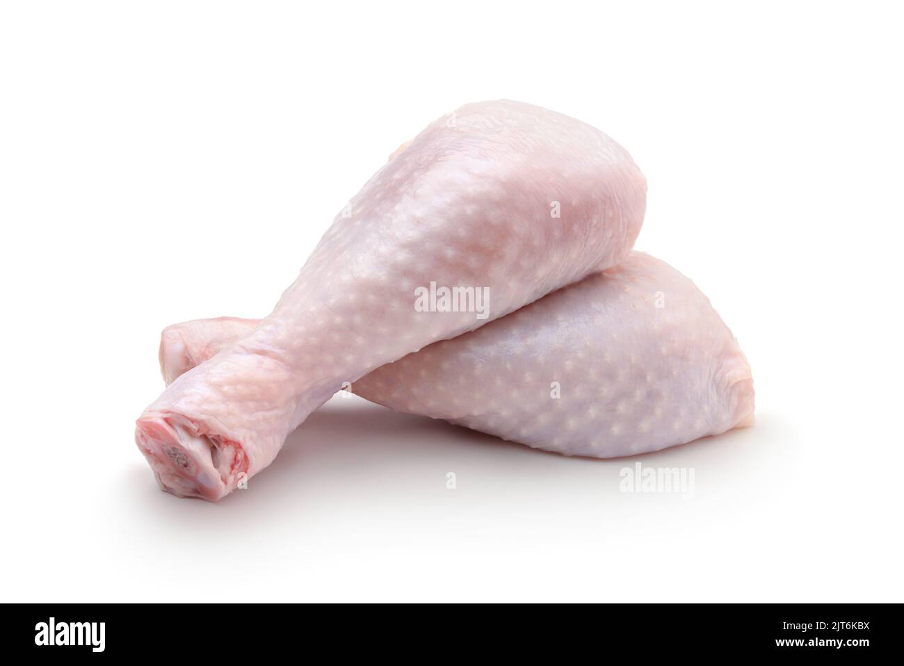 Two fresh raw chicken legs isolated on white Stock Photo - Alamy
