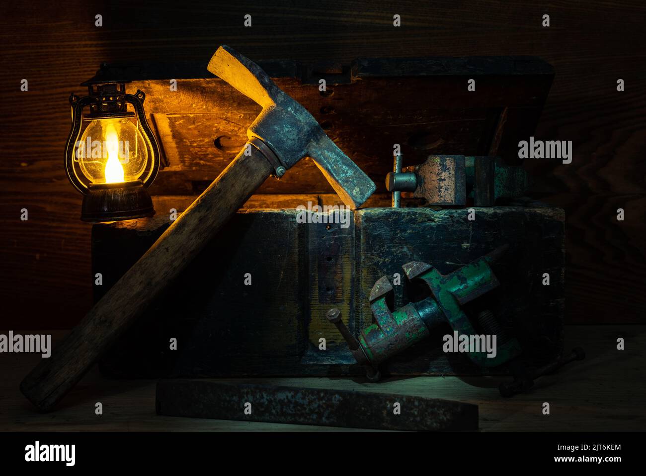 Still life with old hand tools. Pick and vise. Hammer, vise and old box ...