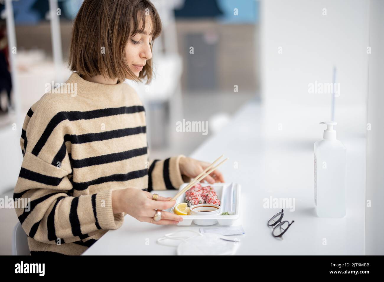 Lady eating sushi hi-res stock photography and images - Alamy