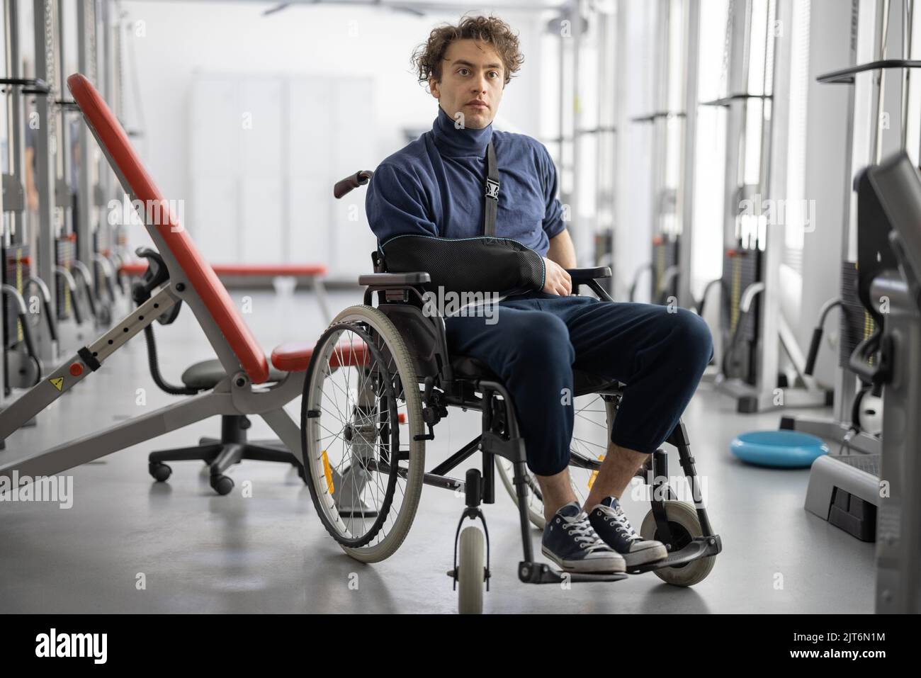 Guy in a wheelchair at rehabilitation center Stock Photo - Alamy