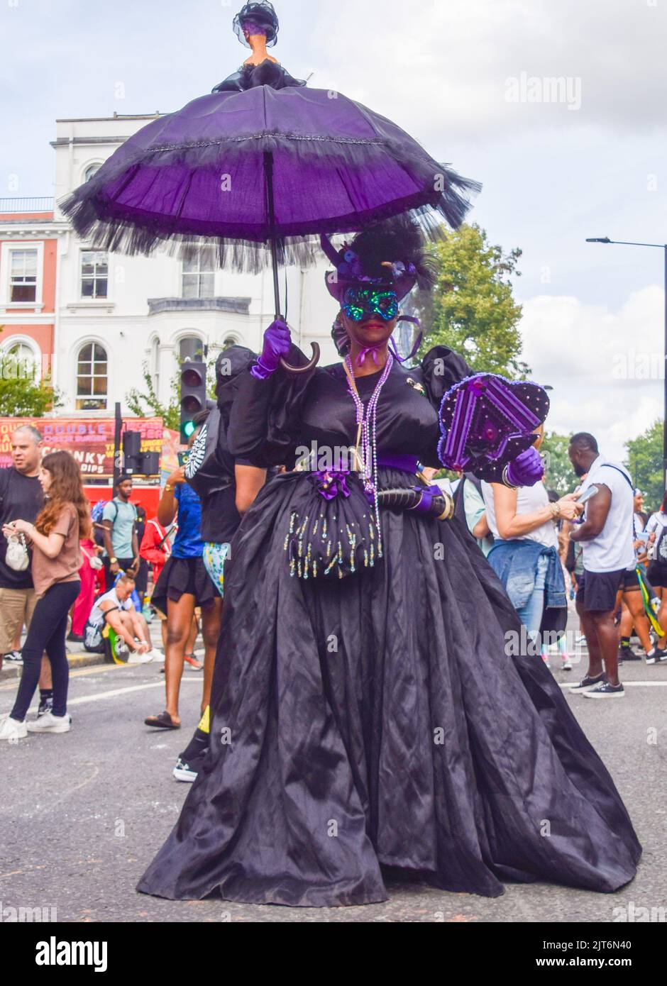 London, UK. 28th August 2022. A participant wears a flamboyant costume ...