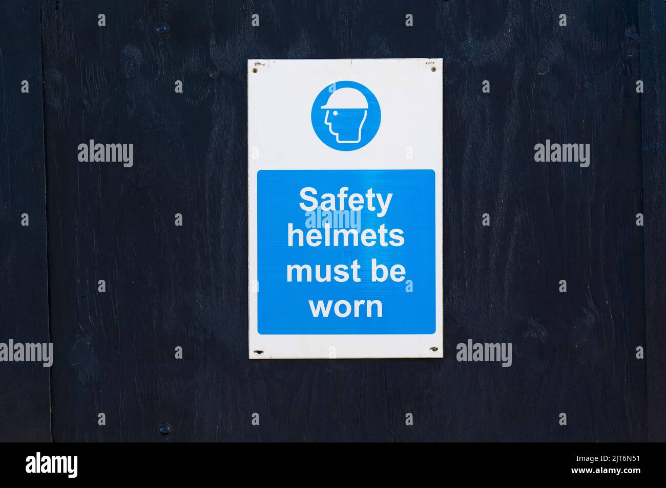 Safety helmets must be worn sign at construction site Stock Photo - Alamy