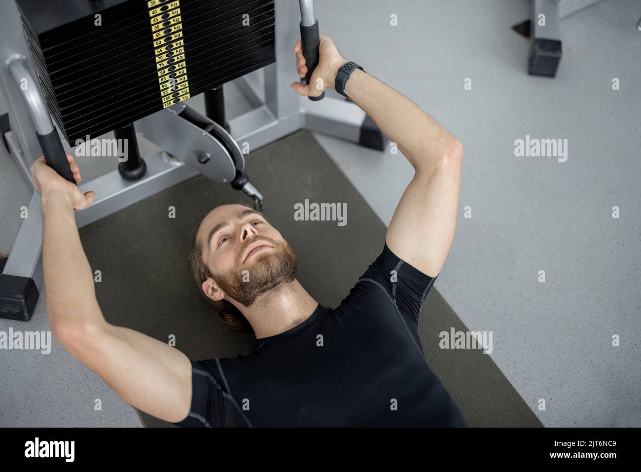 Man doing exercise on decompression simulator at rehabilitation center ...
