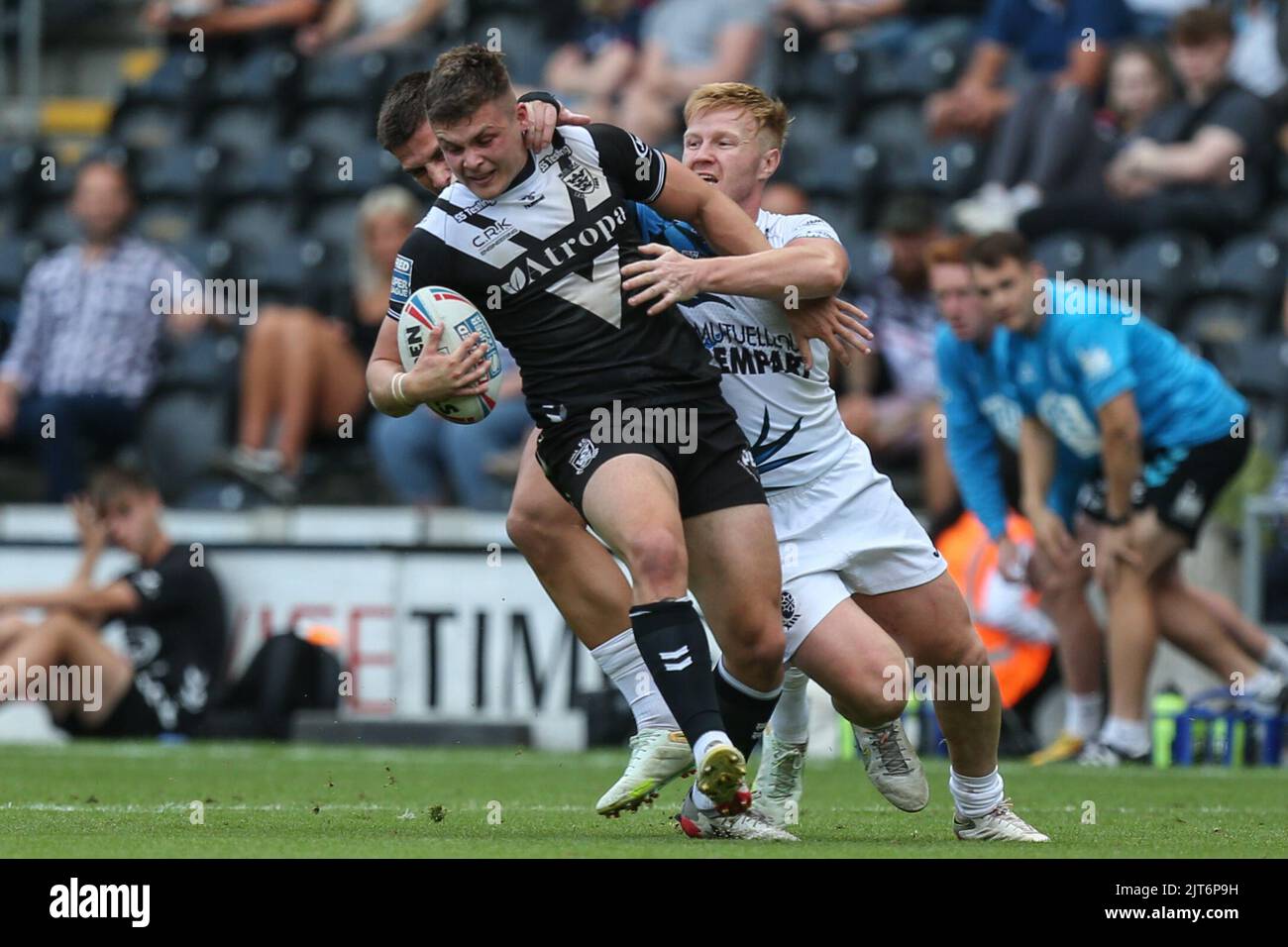 Cameron Scott #24 of Hull FC is stopped by the Toulouse defence Stock ...