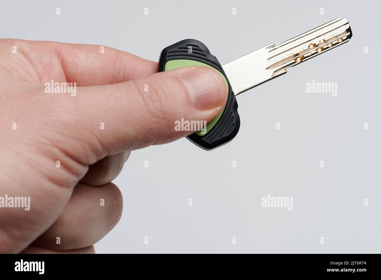 Metal key with chip inside isolated on studio background Stock Photo ...