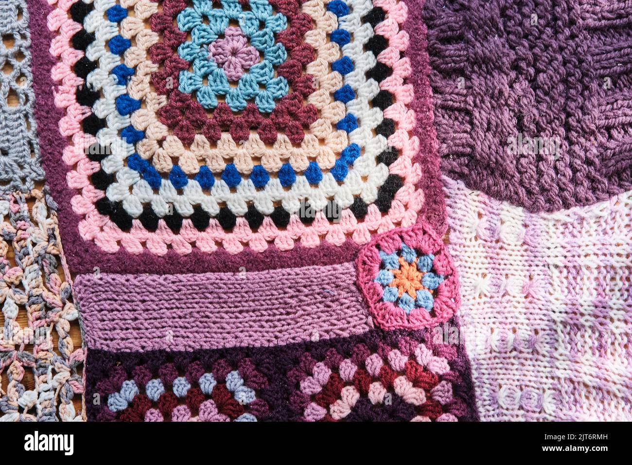 Colourful patchwork fabric is sewn with granny squares patterns Stock ...