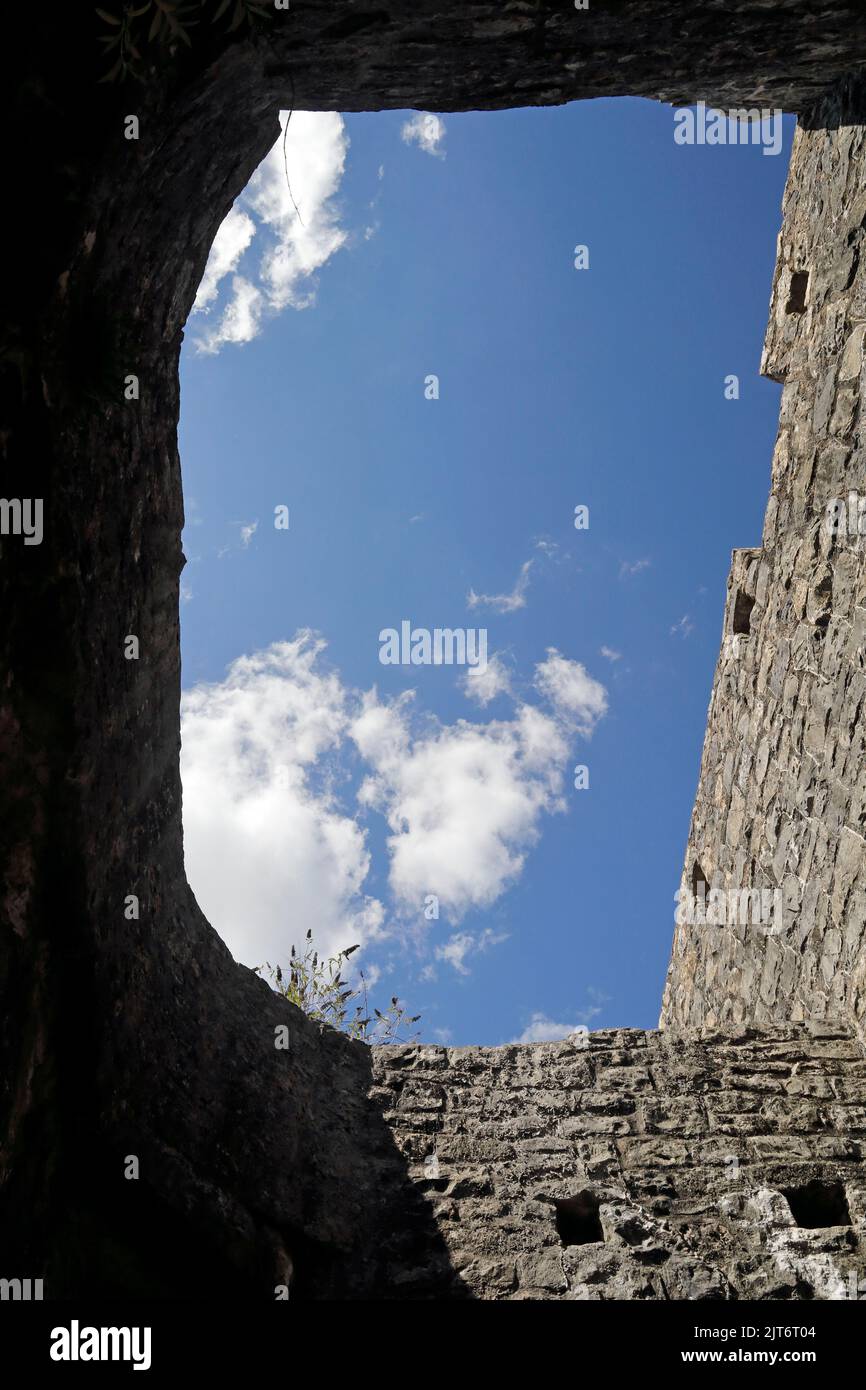 Unusual view of sky and cloud through a gap in town wall archway ...