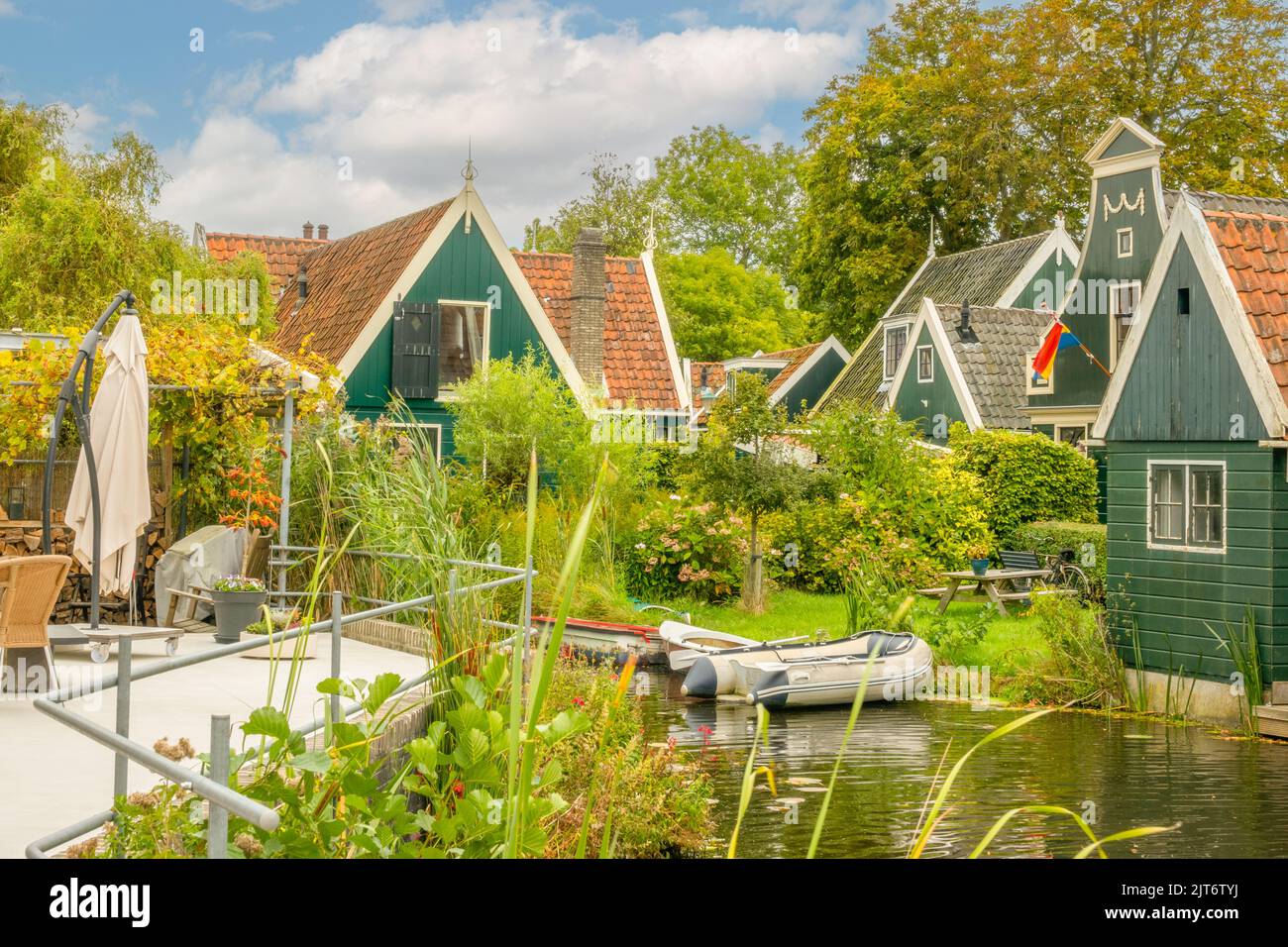 Netherlands. Summer day in Zaandam. Dutch country houses and a pond ...