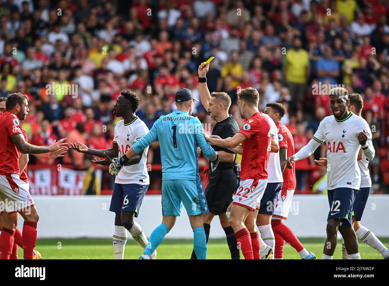 Referee Craig Pawson gives Steve Cook #3 of Nottingham Forest a yellow ...