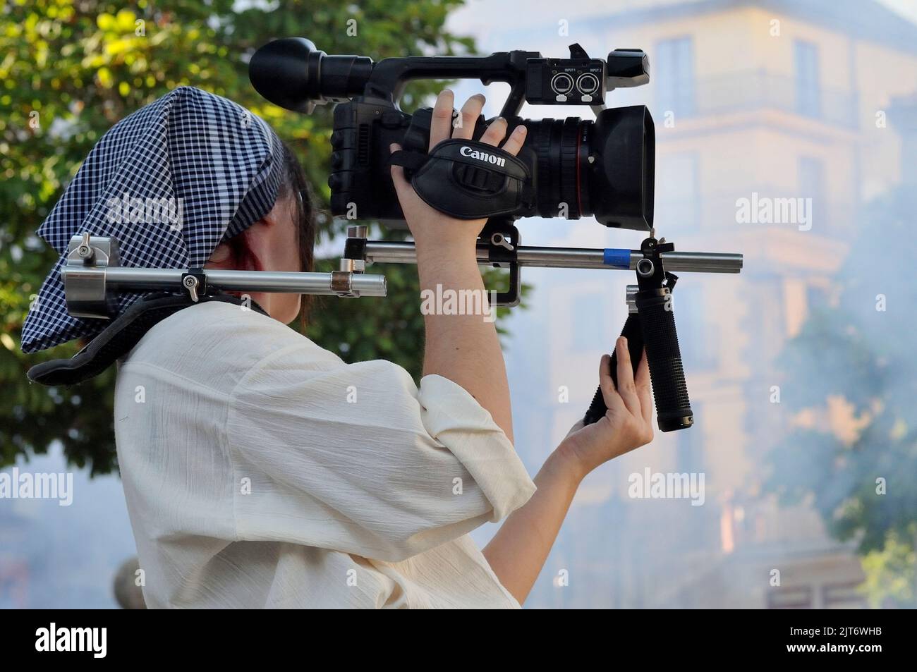 Girl with video camera working at the historical reenactment of the ...