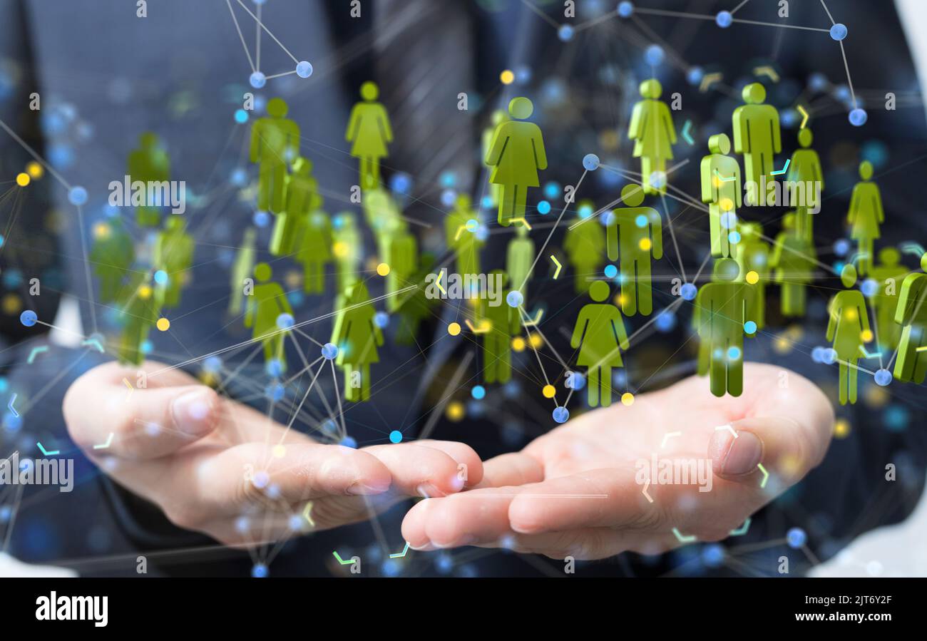 A businessman presenting the 3D rendered green person icons in a ...