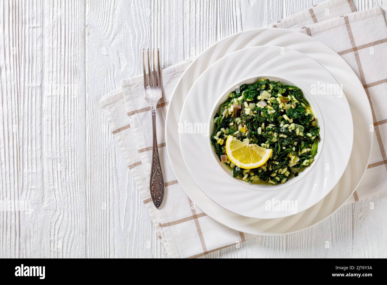 Spanakorizo, Greek spinach and rice pilaf with lemon, dill, scallion in ...