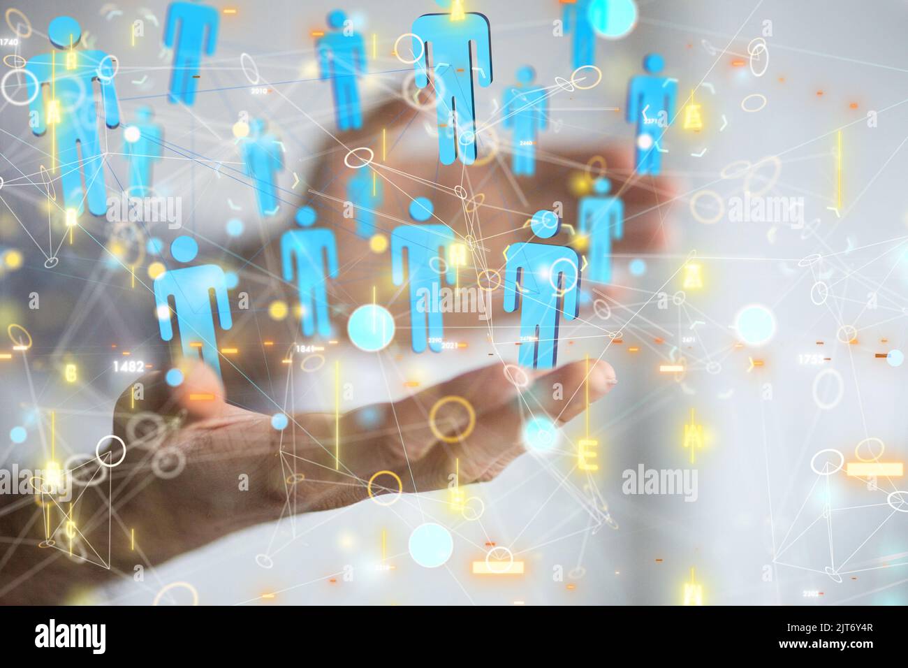 A businessman presenting the 3D rendered blue person icons in a ...