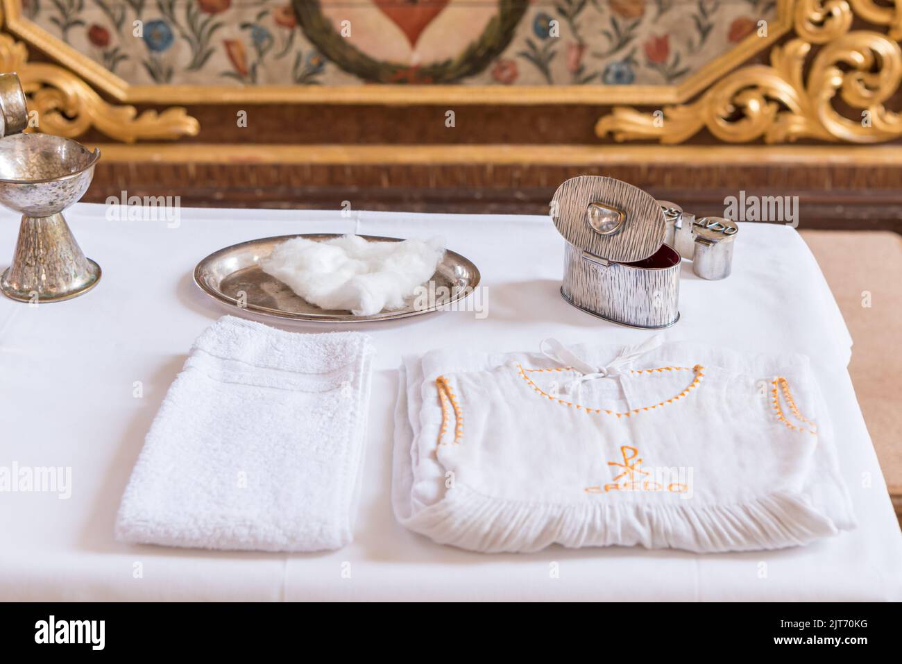 chrisam oil in a vessel and holy water in a bowl. Preparation for the sacrament baptism Stock ...