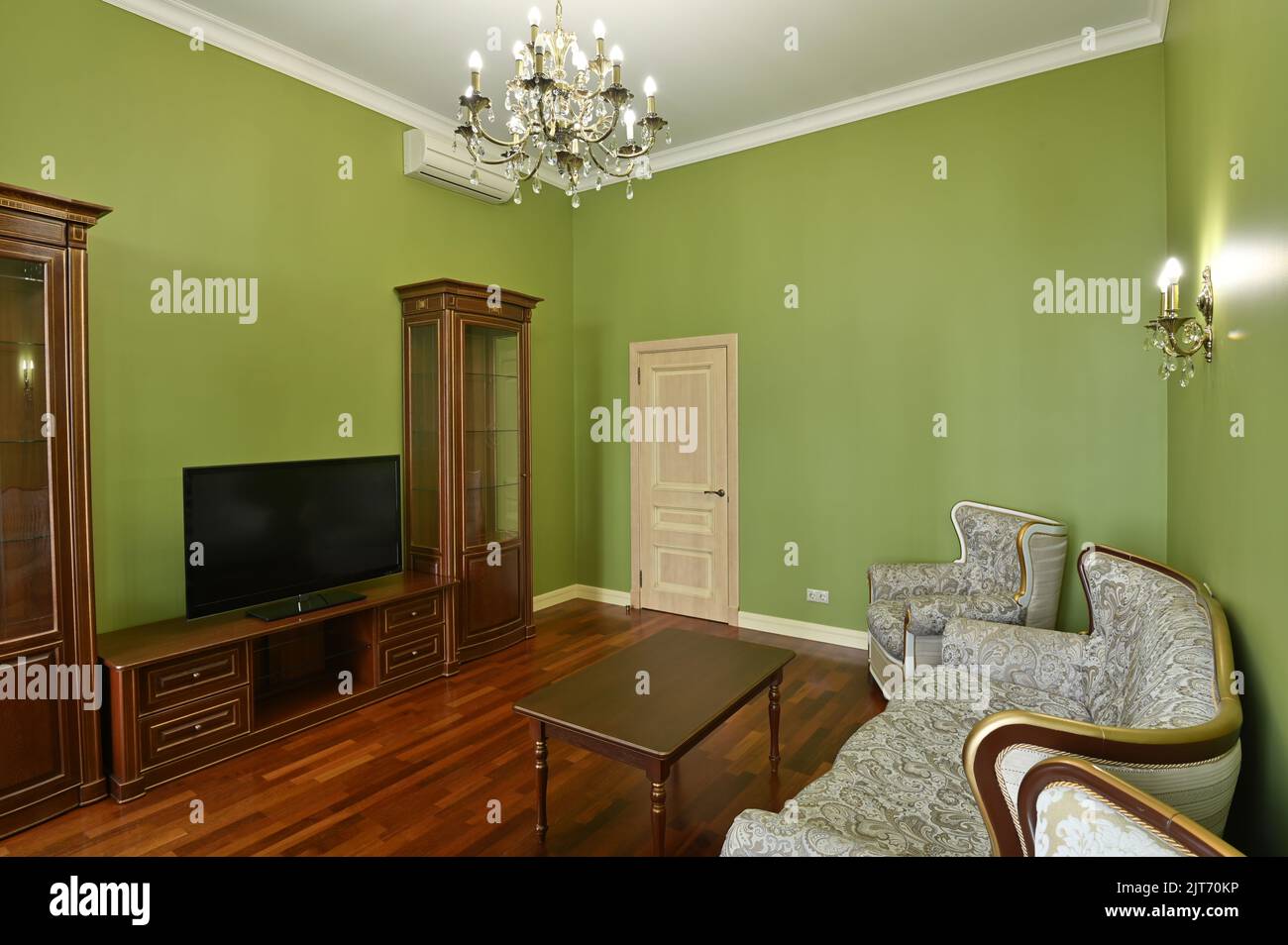 A beautiful hall in a large house with high ceilings antique furniture ...