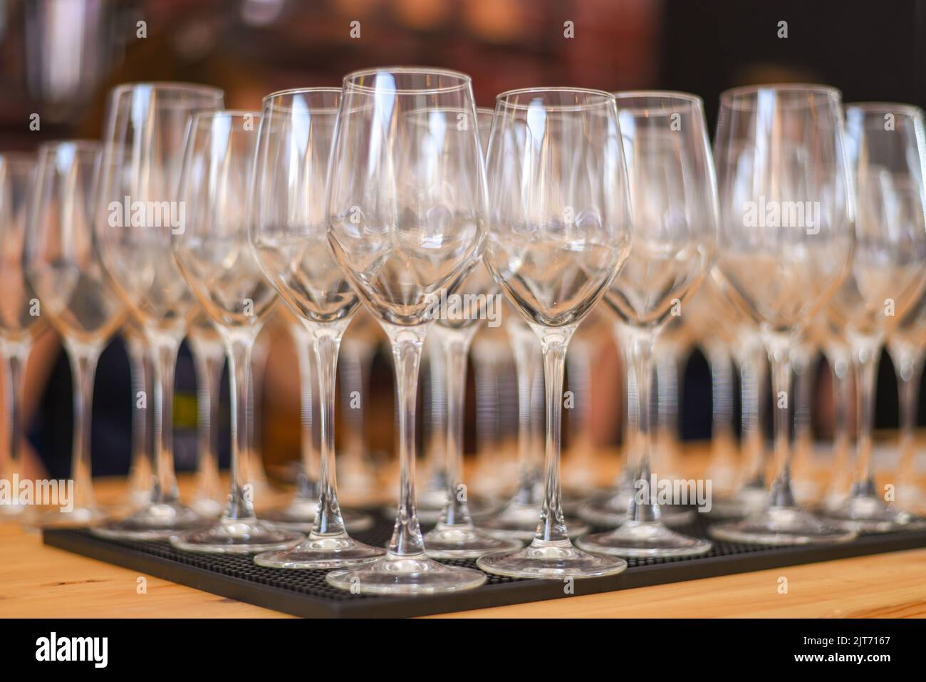 Set of new bar glassware on the bar counter. lots of empty glasses ...