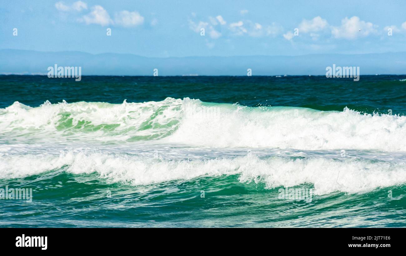 abstract sea background. green wave close up. blurry water in evening ...