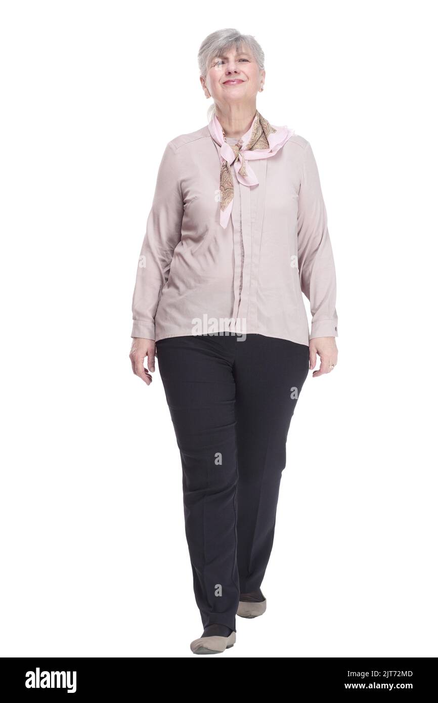 confident old lady striding forward. isolated on a white background ...