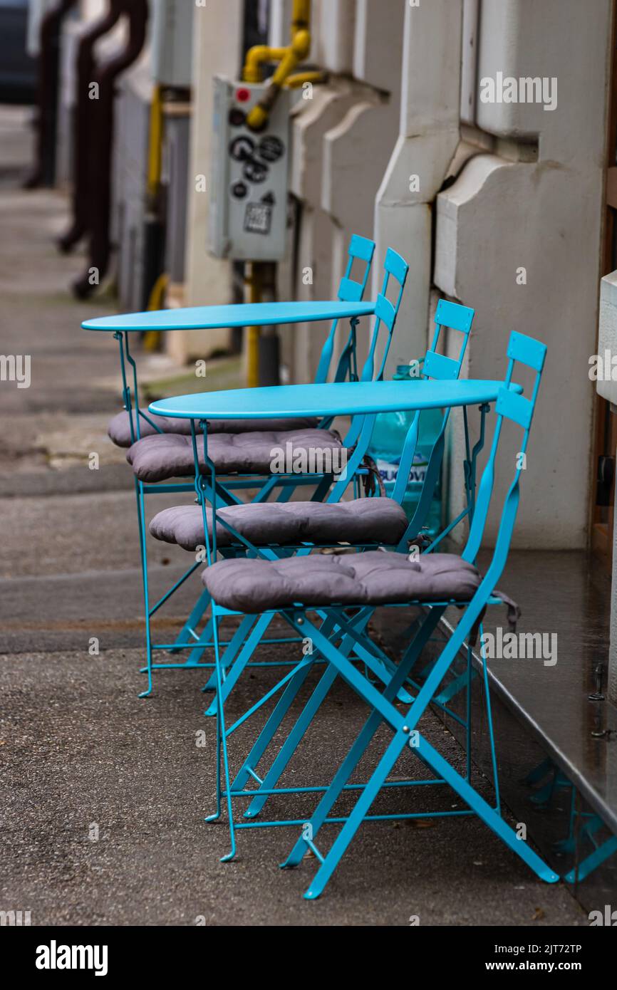 Blue empty restaurant table on sidewalk Stock Photo - Alamy