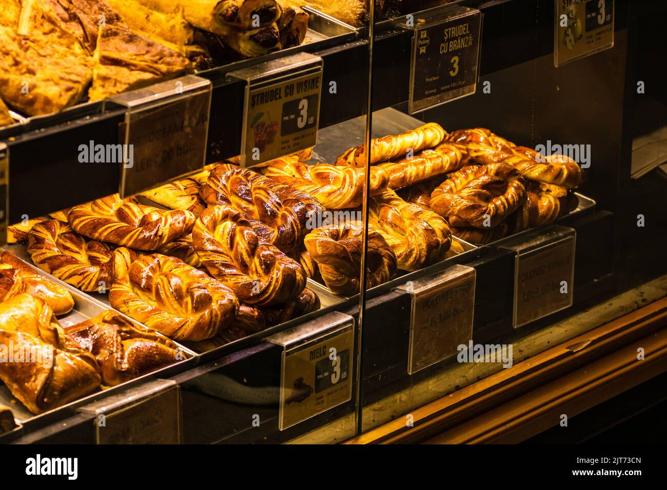 Baked pastry in a bakery window display Stock Photo - Alamy