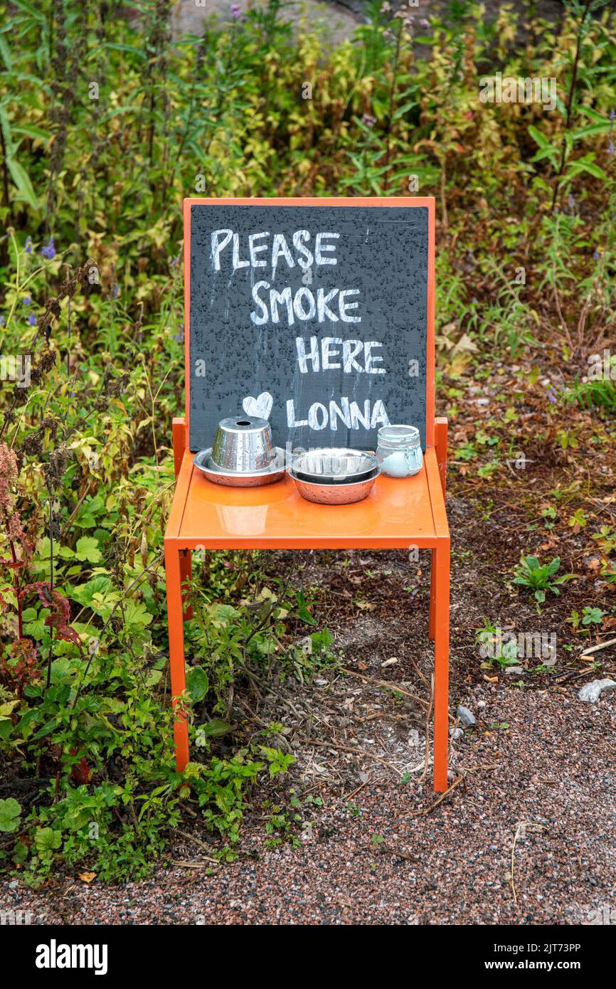Please smoke here. Designated smokin area with ashtrays in Lonna Island ...
