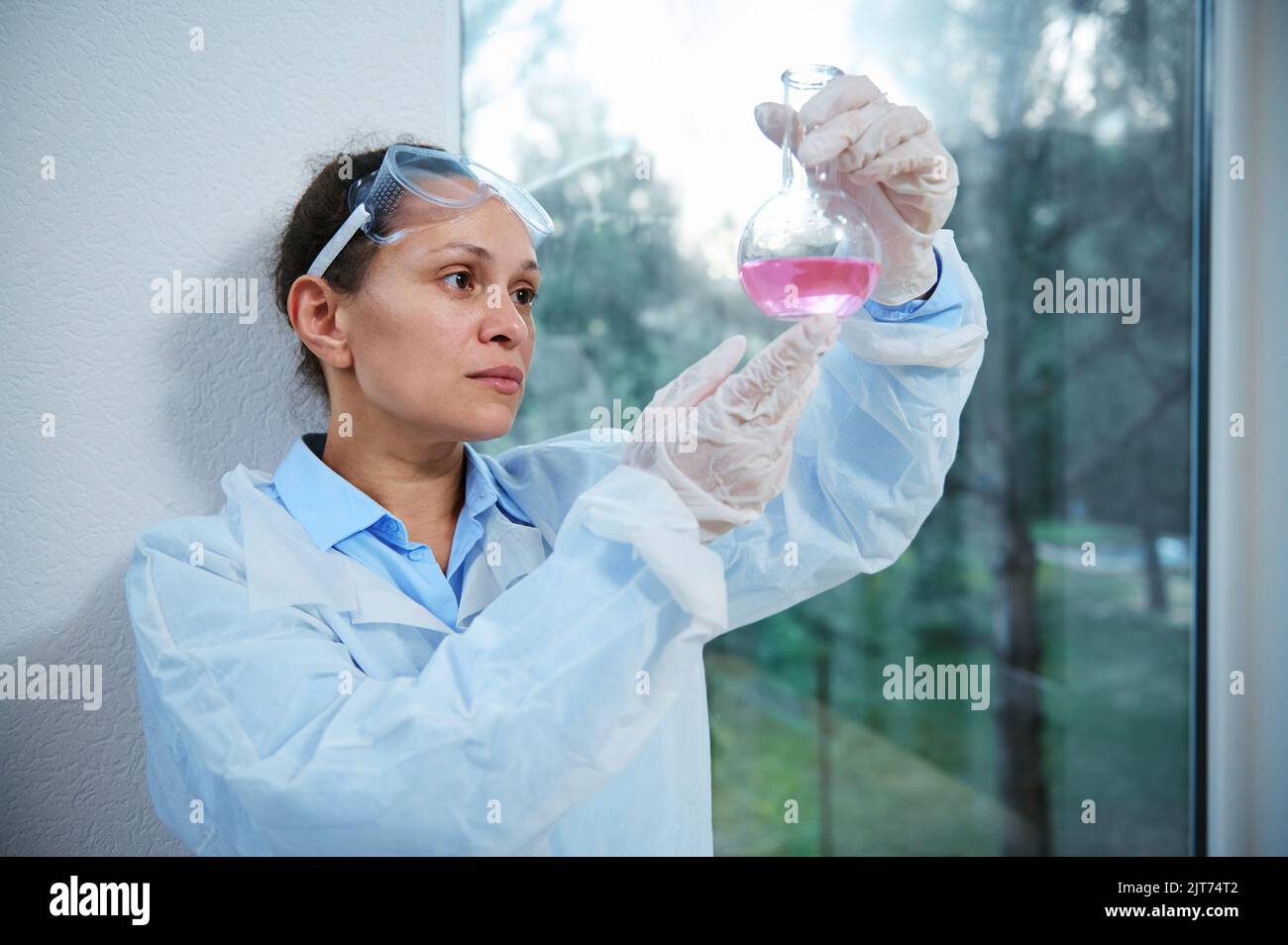 Pretty woman scientist pharmacologist works on new generation drug or ...
