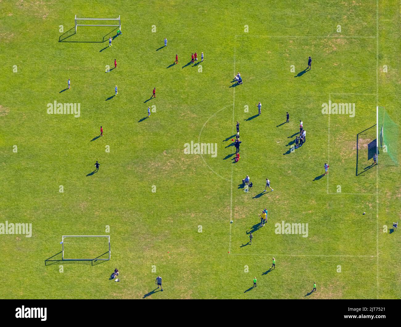 Aerial view, soccer players on the soccer field of the district sports ...