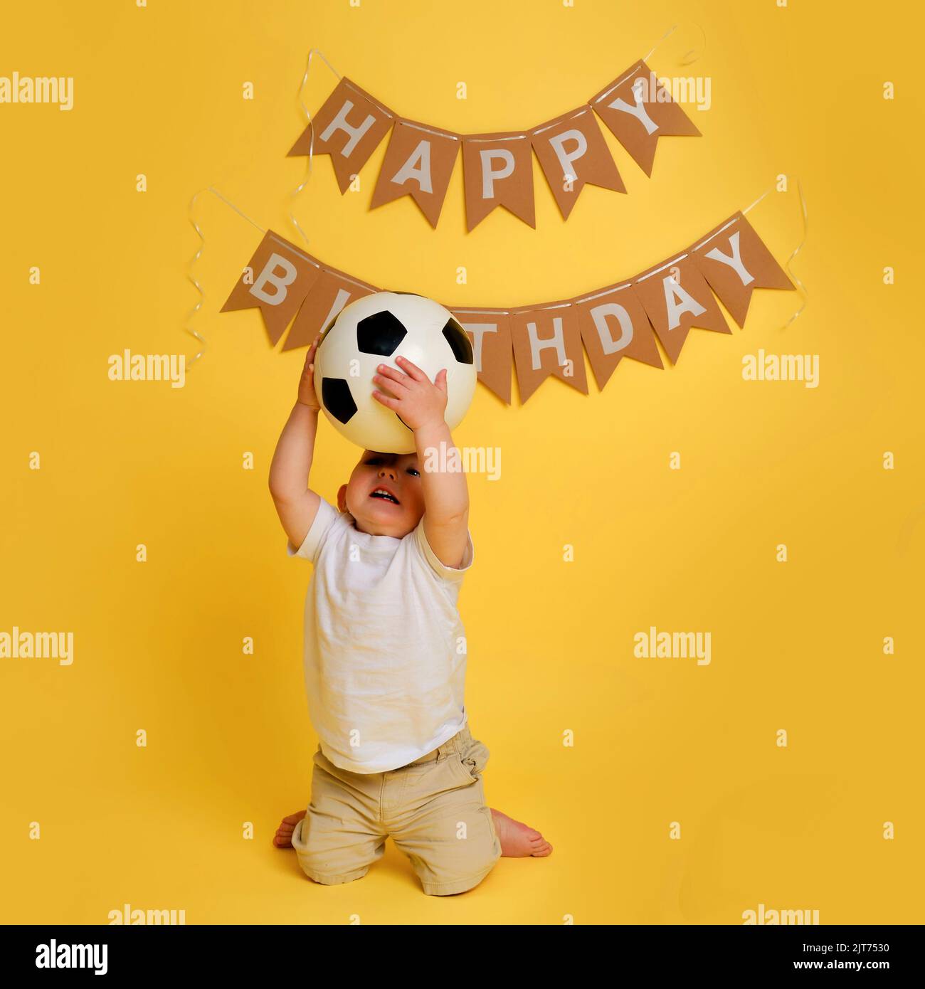Decorations on a studio yellow background for celebrating the first ...