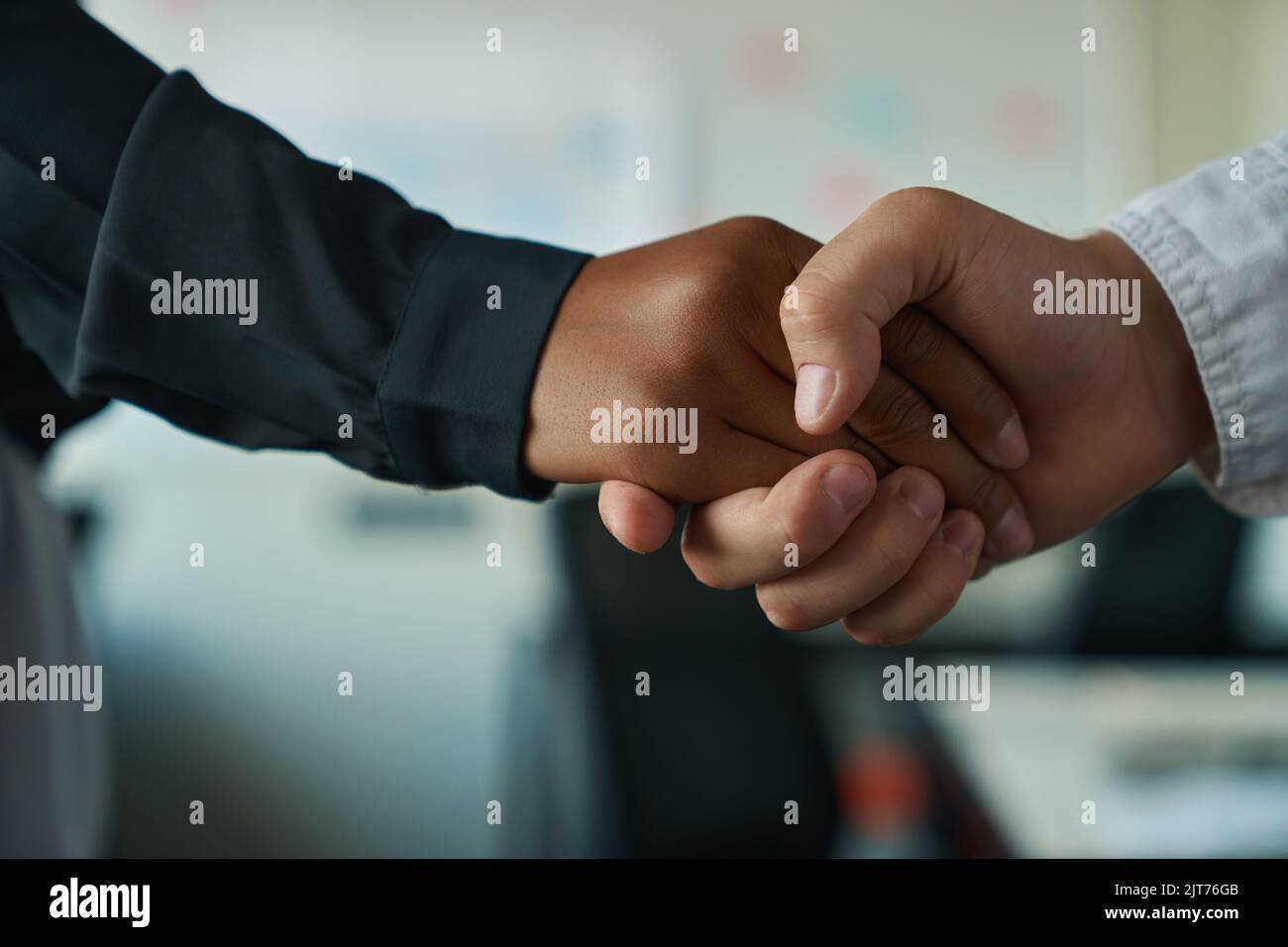 Friendly handshake caucasianmuke and African American Woman Stock Photo ...